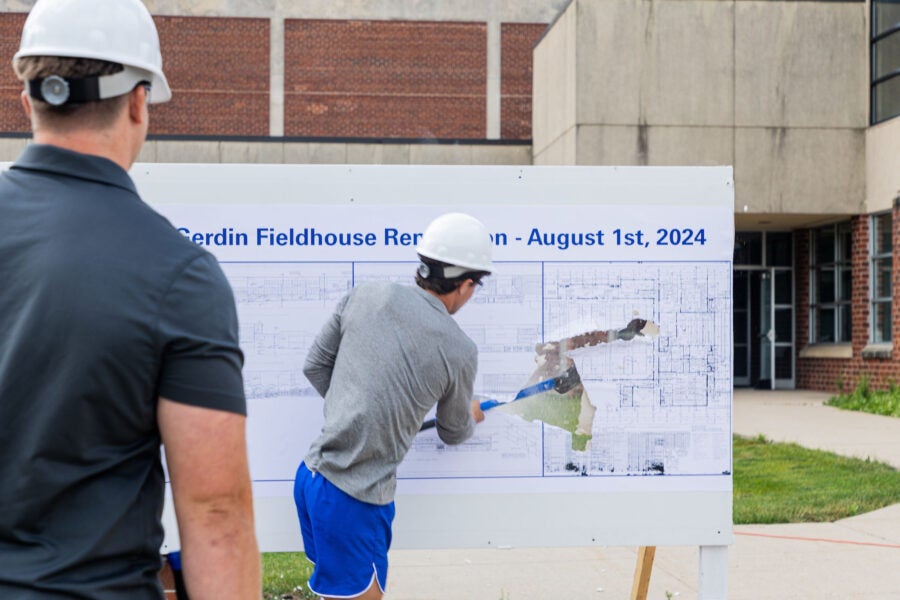 Student-athletes break a wall as Gerdin Fieldhouse construction begins ...